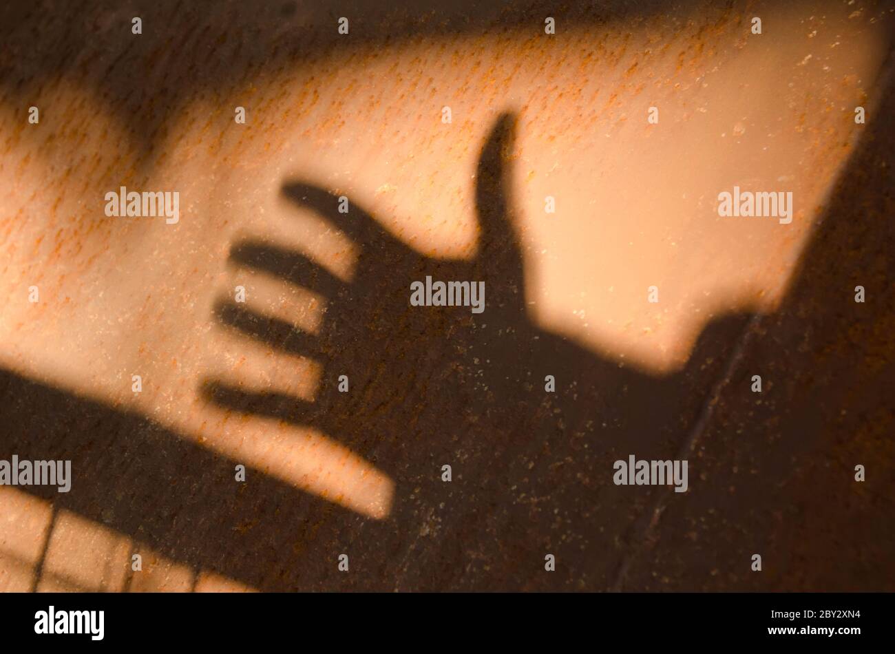 shadow of a hand on steel Stock Photo - Alamy