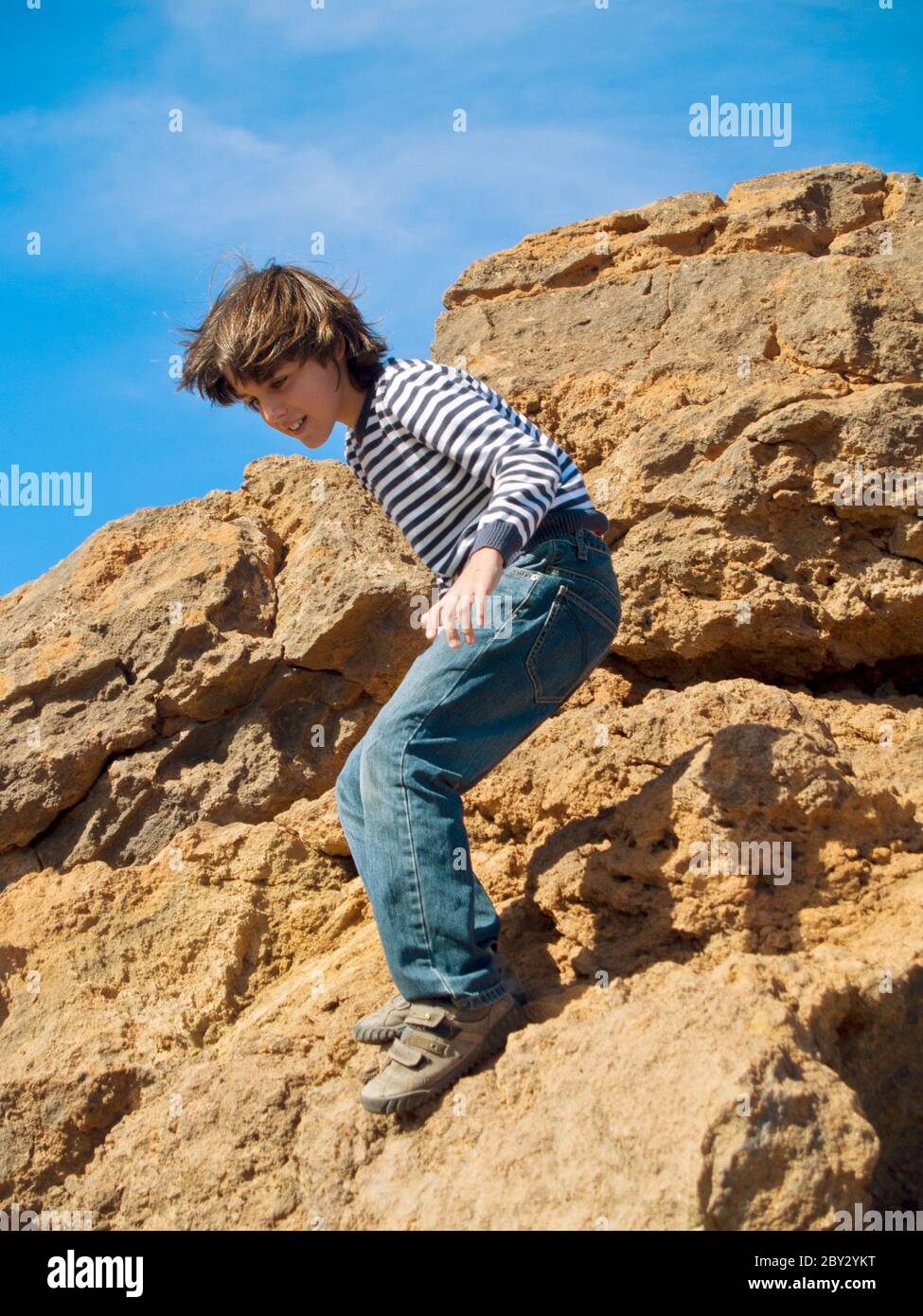 boy playing in rocks Stock Photo - Alamy