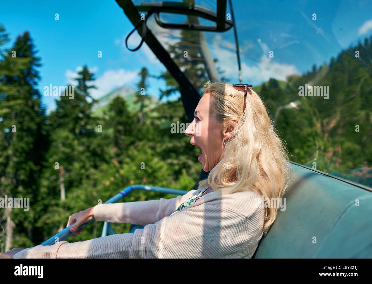 emotional girl on a funicular Stock Photo - Alamy