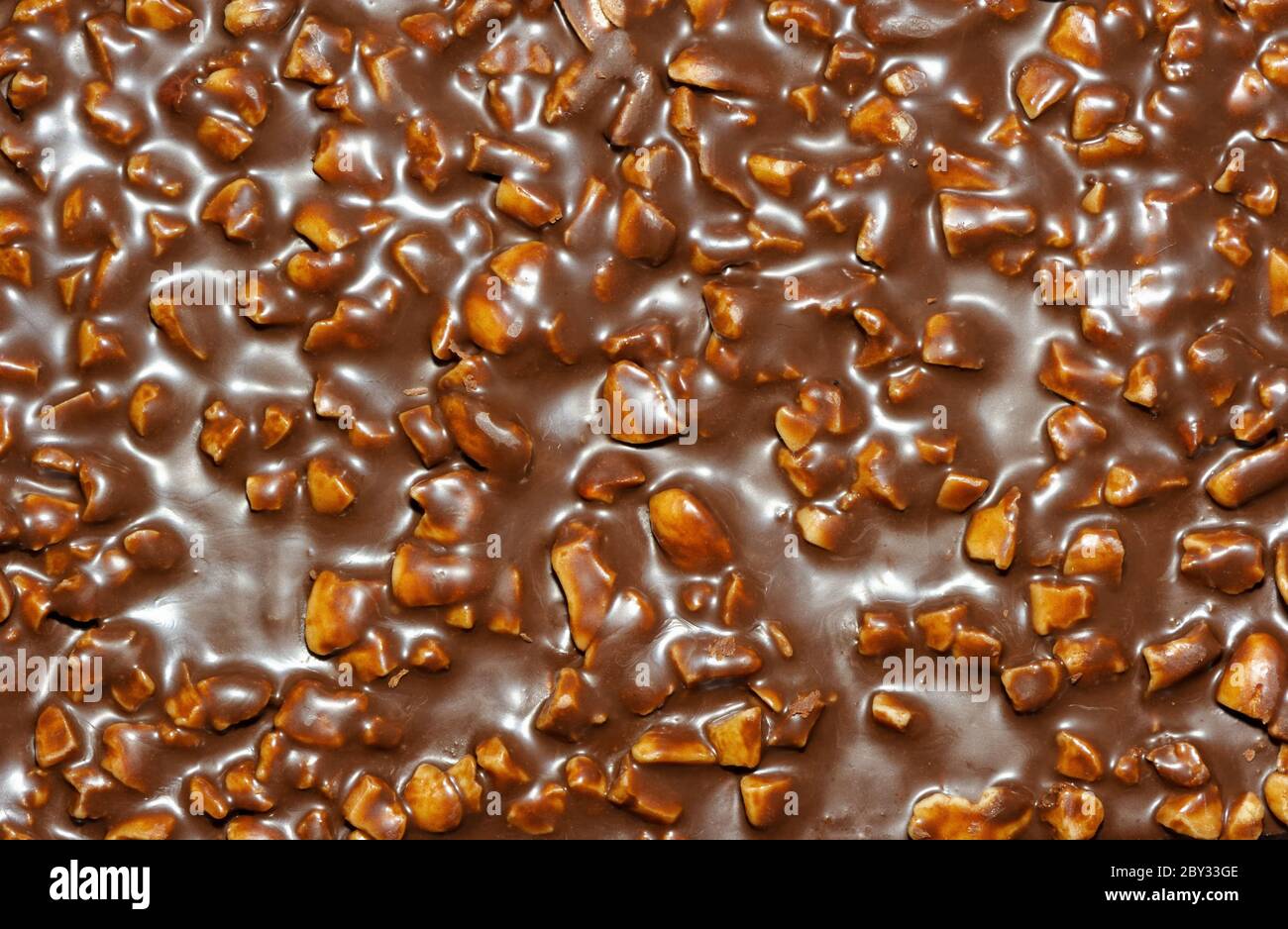 Texture of chocolate with nuts Stock Photo - Alamy
