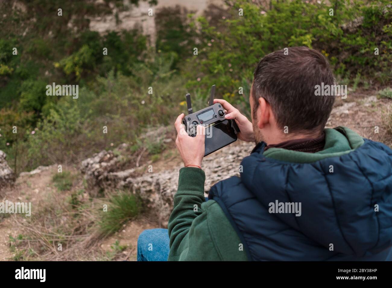 Young Man Piloting Drone Outdoor In Nature Guy Testing Aerial Unmanned Vehicle At Nature