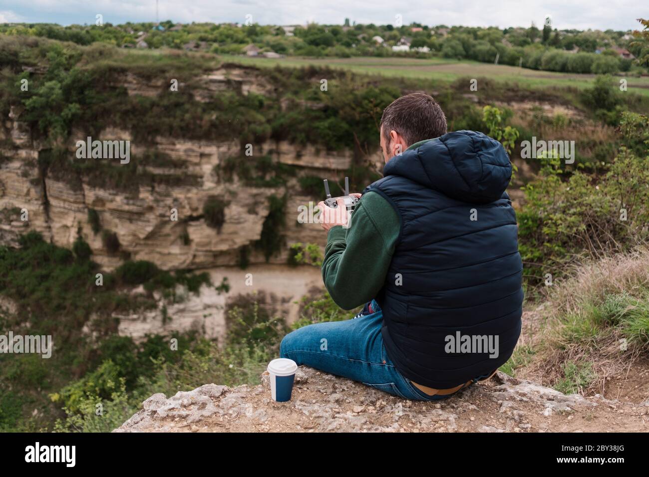 Young Man Piloting Drone Outdoor In Nature Guy Testing Aerial Unmanned Vehicle At Nature