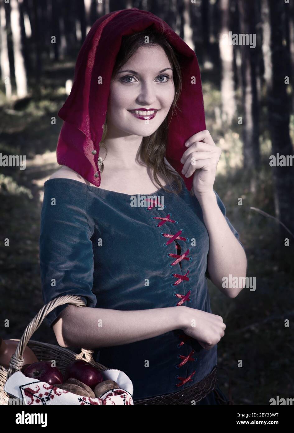 red Riding hood standing in a wood Stock Photo - Alamy