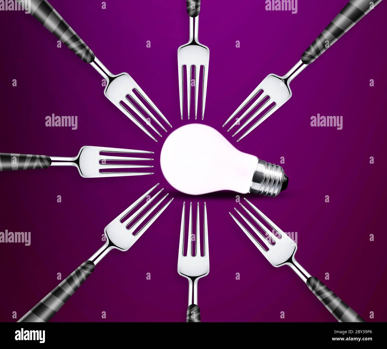 light bulb between forks Stock Photo - Alamy