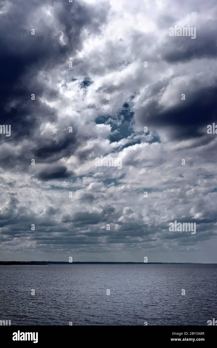 Hurricane storm clouds over ocean waves hi-res stock photography and ...