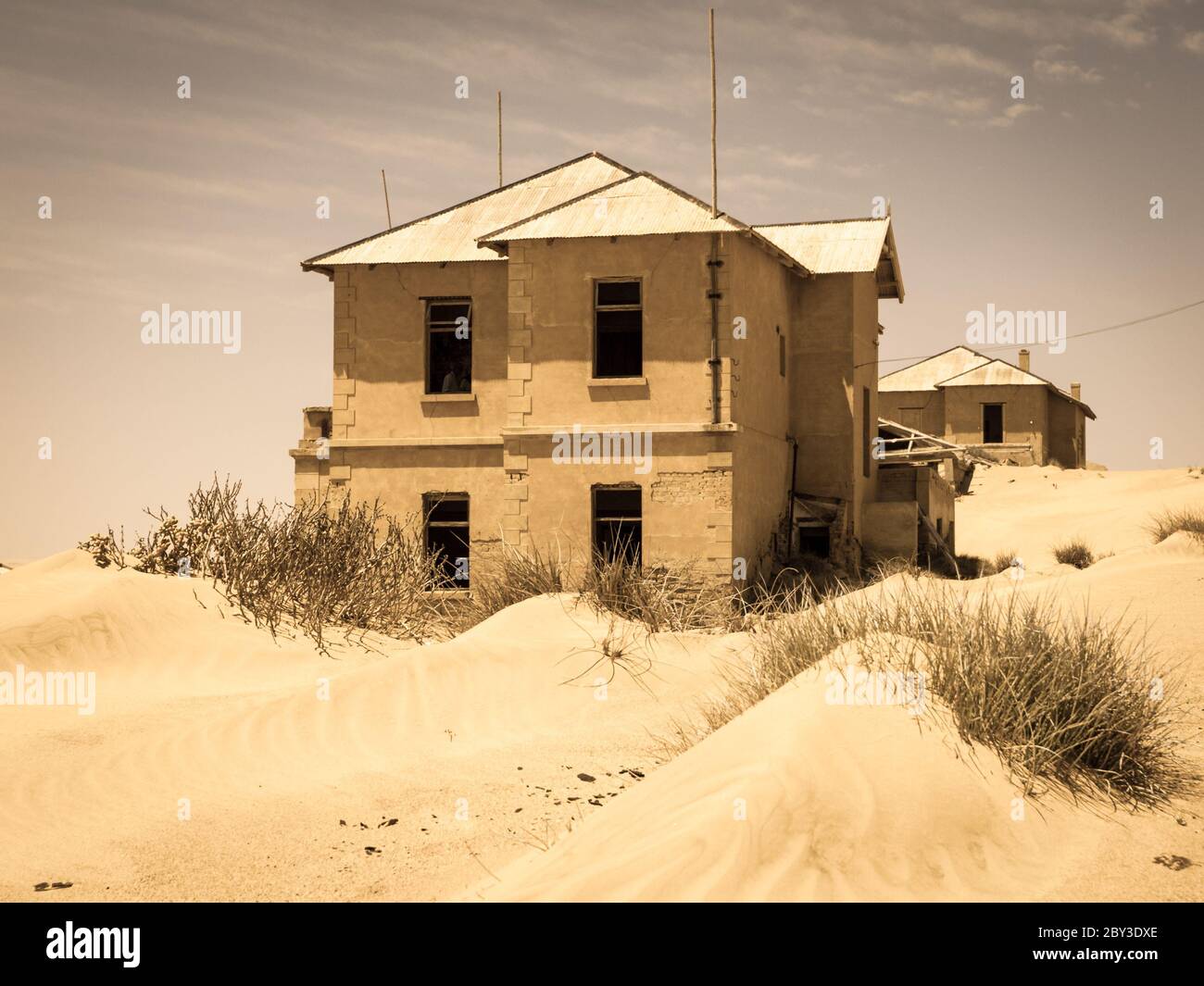 Ghost buildings of old diamond mining town Kolmanskop near Luderitz in ...