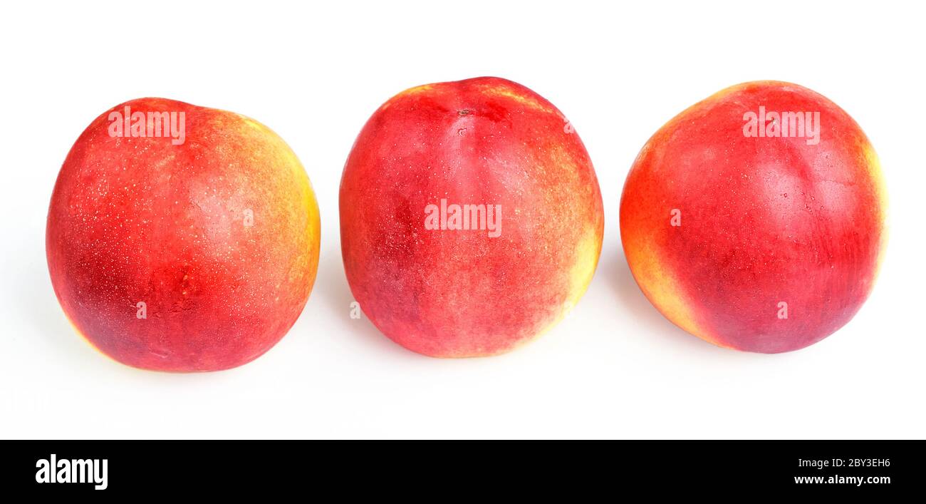 Three peaches isolated on white Stock Photo - Alamy