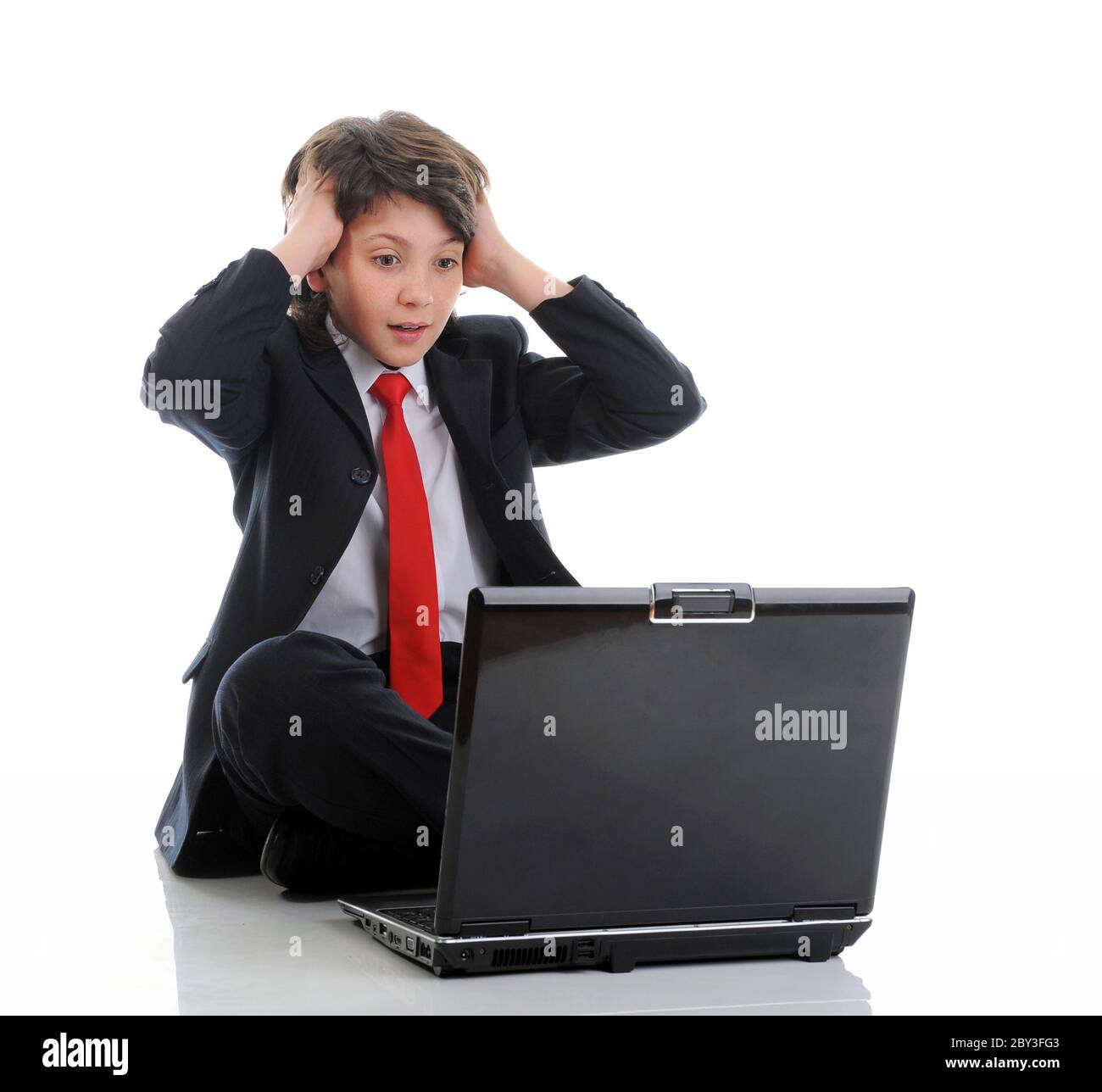 boy in business suit sitting in front of computer Stock Photo - Alamy