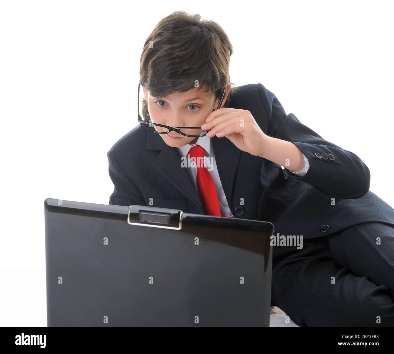 boy in business suit sitting in front of computer Stock Photo - Alamy