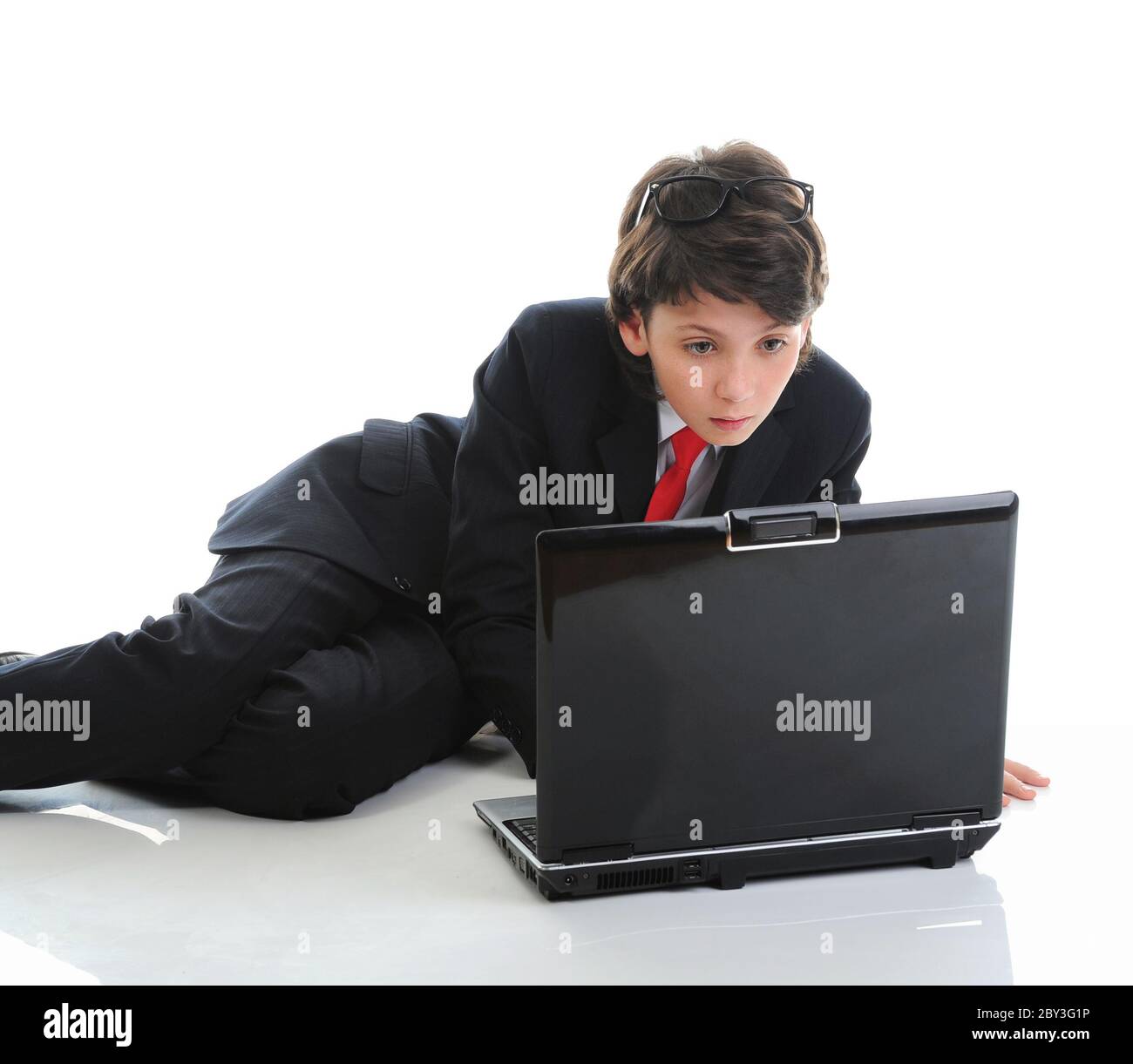 boy in business suit sitting in front of computer Stock Photo - Alamy