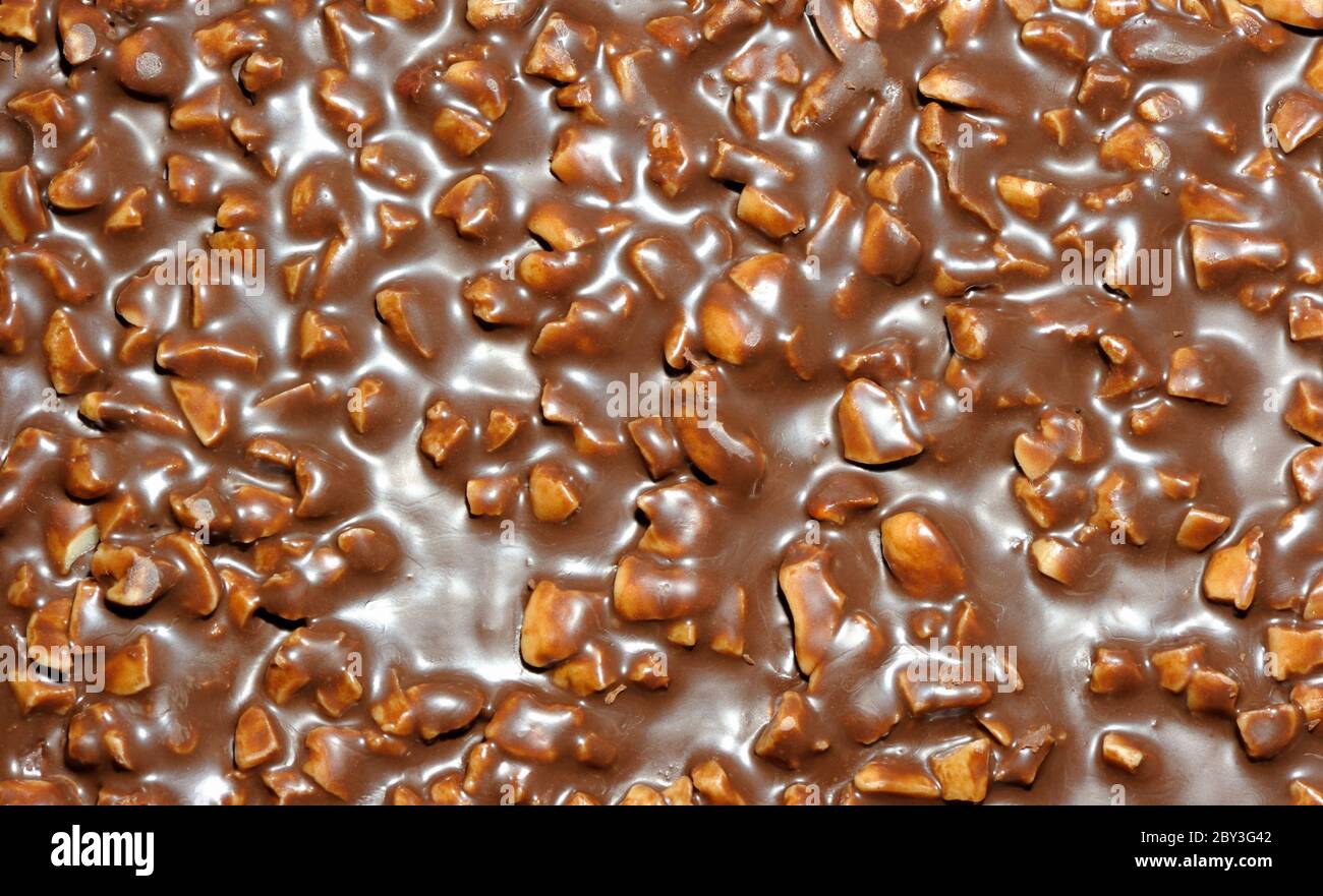 Texture of chocolate with nuts Stock Photo - Alamy