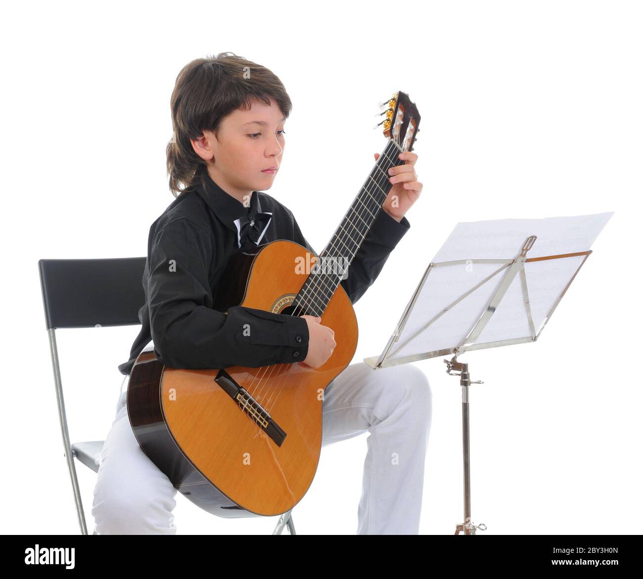 Little boy musician playing guitar Stock Photo - Alamy