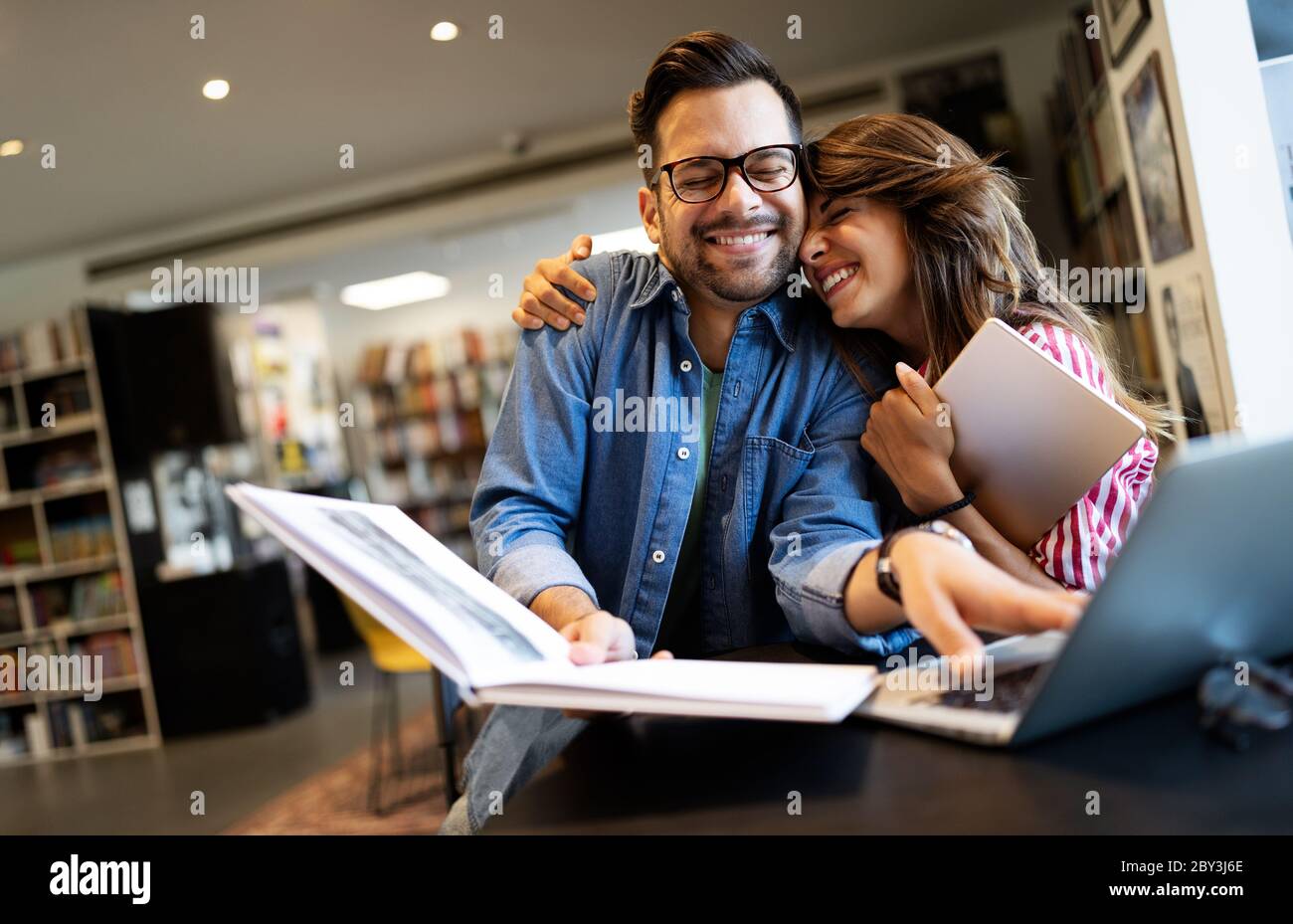 Group of college students studying in the school library Stock Photo ...