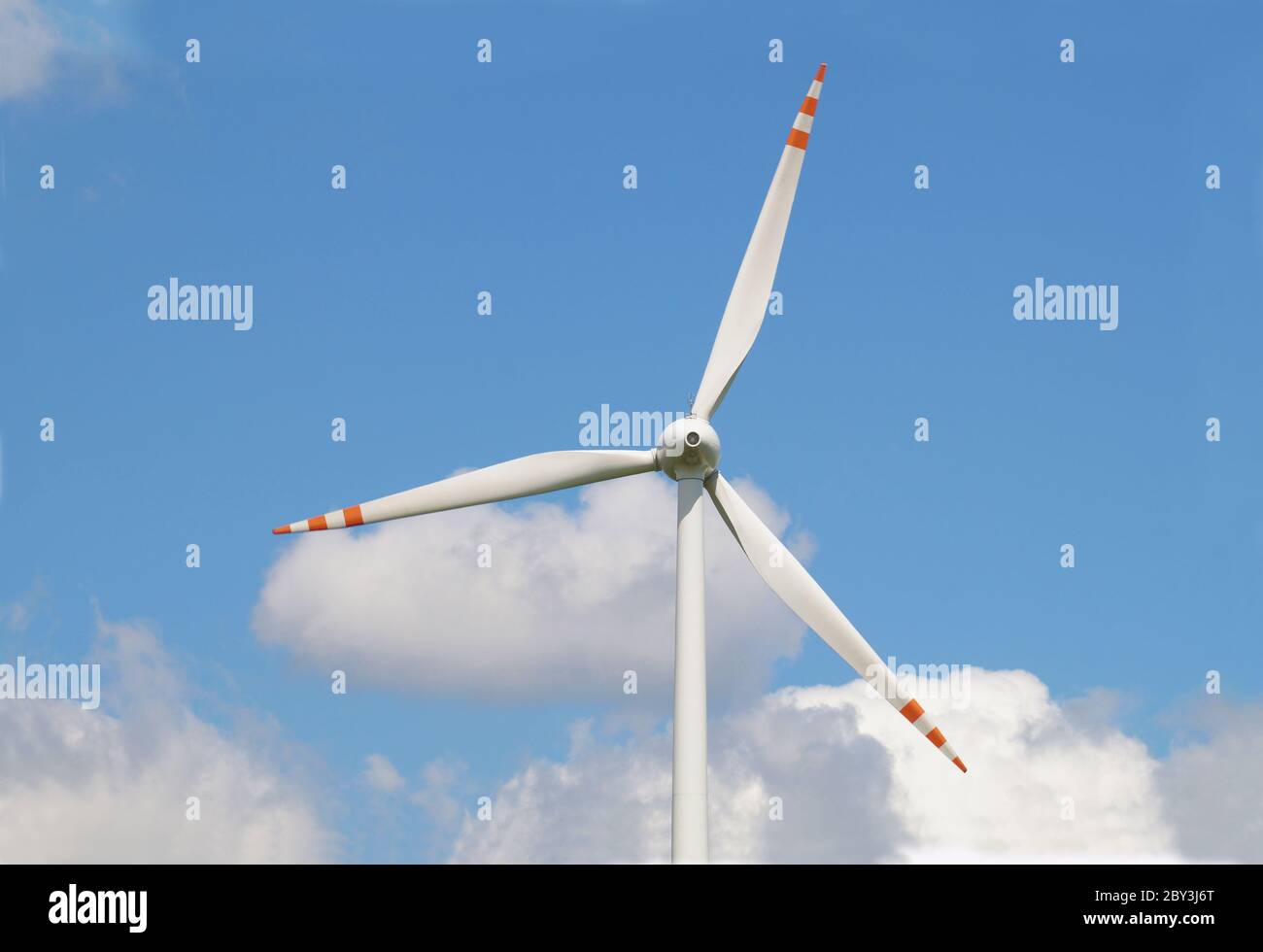 Closeup of a wind turbine wing in the background of a sunny sky with ...