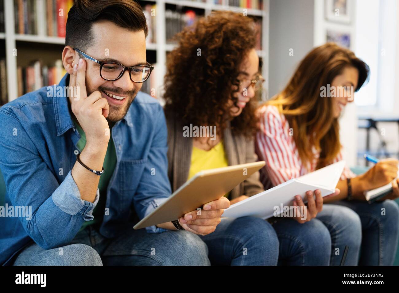Young university students studying together. Group of multiracial ...