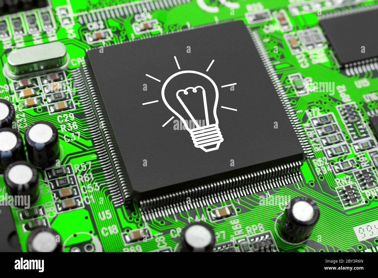 Bulb on computer chip Stock Photo - Alamy