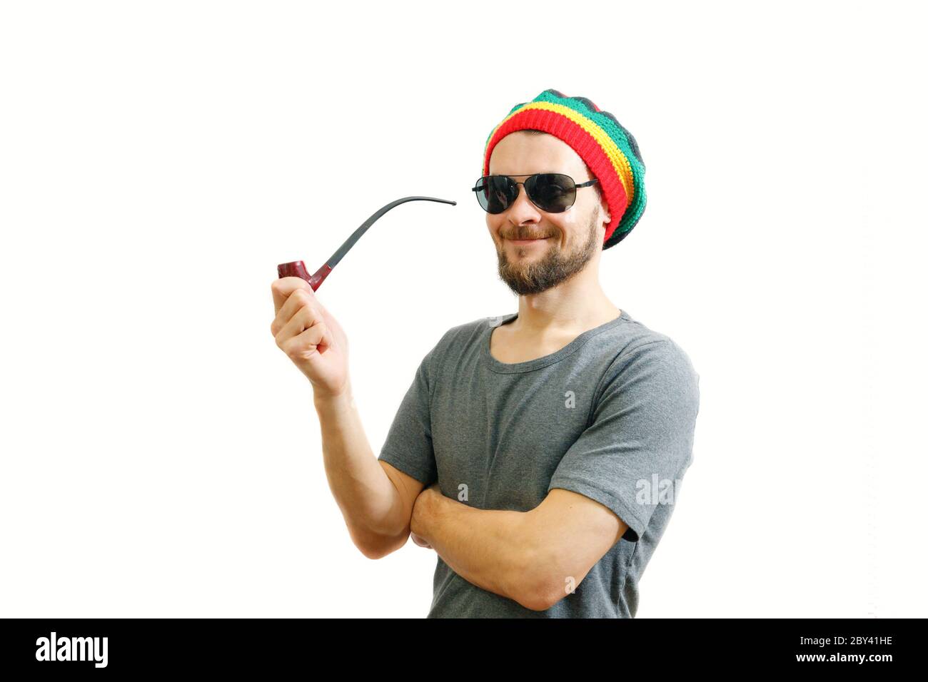 Young caucasian rasta man in jamaica hat, sunglasses and grey t-shirt ...