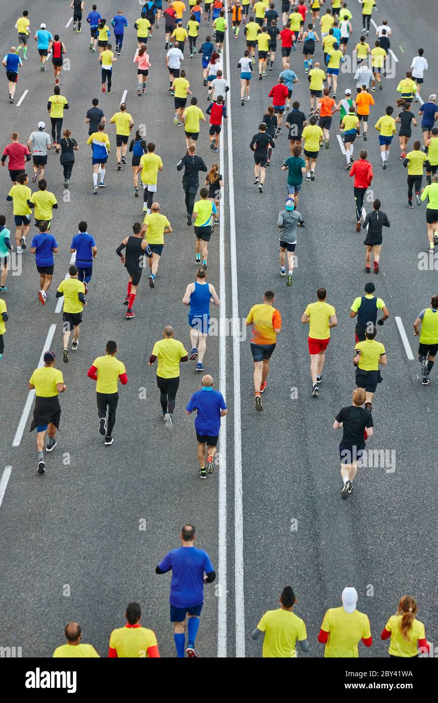 Marathon runners on the street. Healthy lifestyle. Urban athletes ...