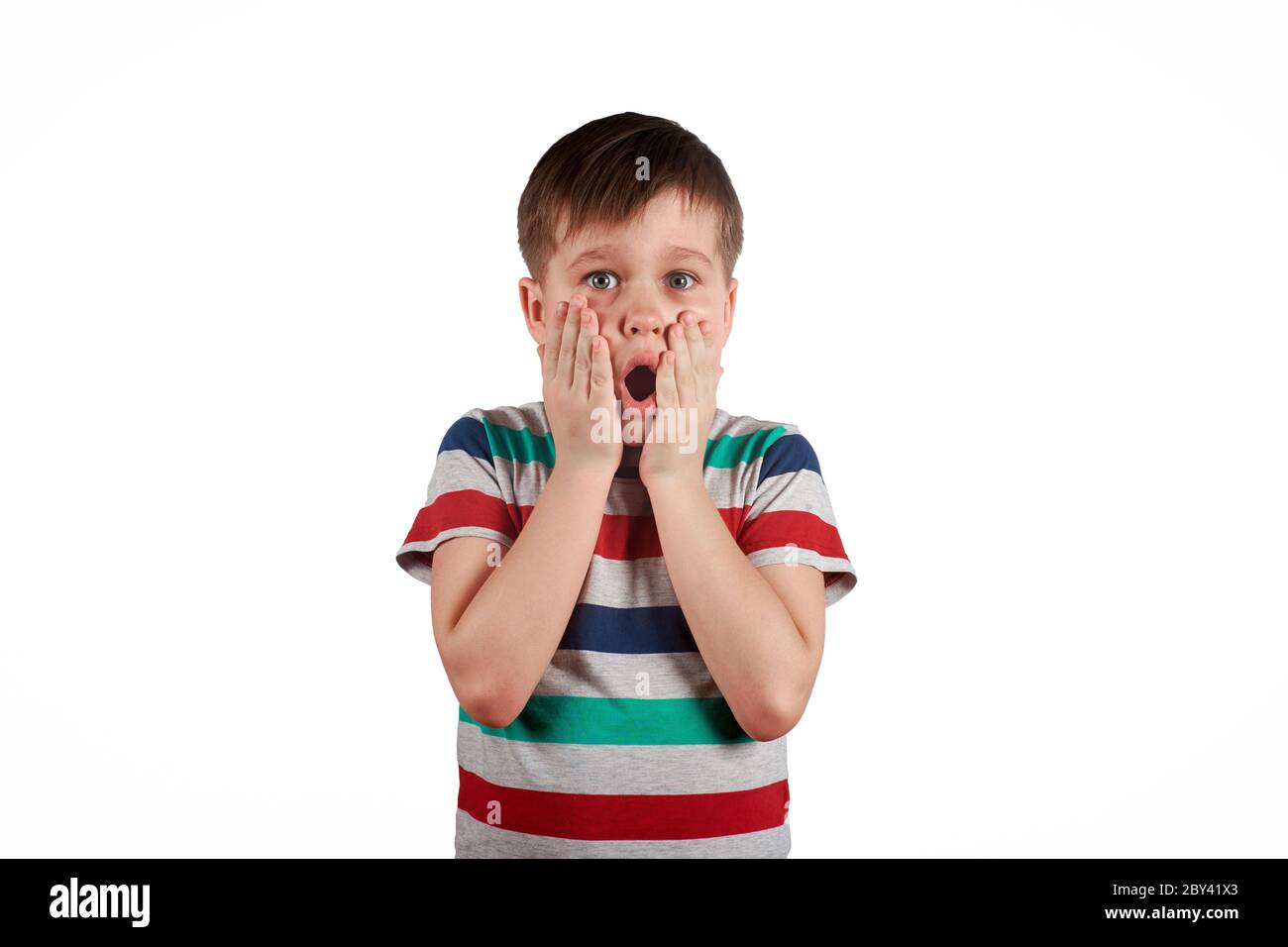 Very scared and surprised boy isolated on white background Stock Photo ...
