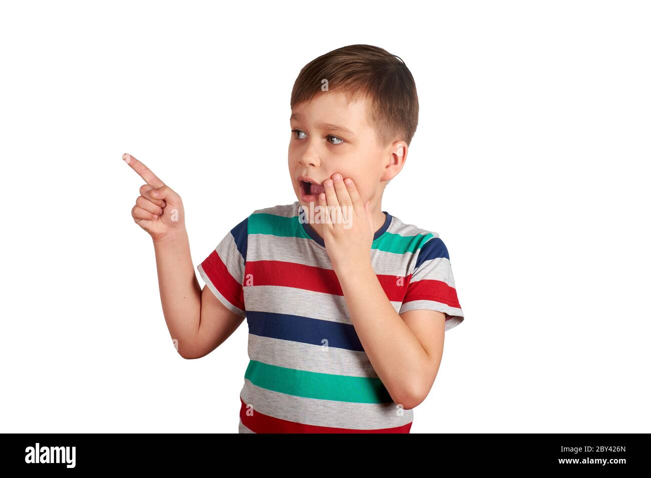 Cute little kid pointing with his finger on something, isolated on ...