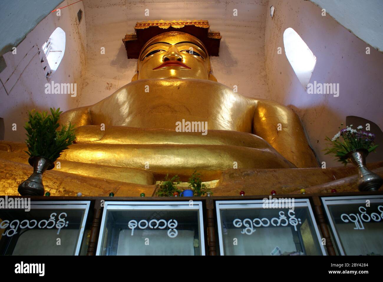 Golden seating Buddha Stock Photo - Alamy