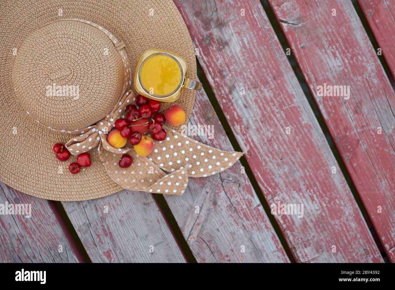 Glass of tropical exotic multifruit juice and fruits at the pier ...