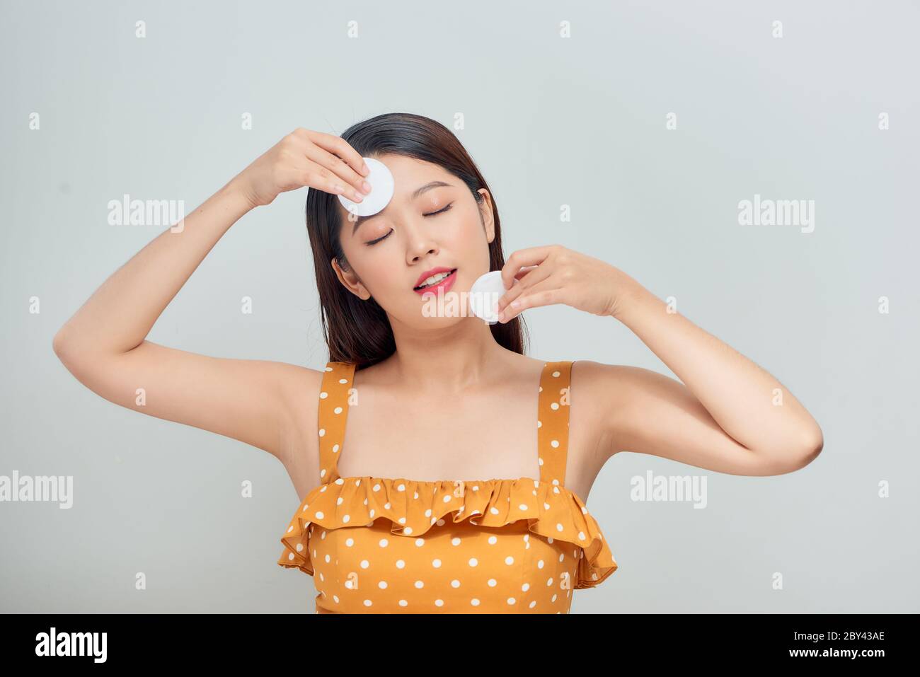 Woman removing makeup hi-res stock photography and images - Alamy