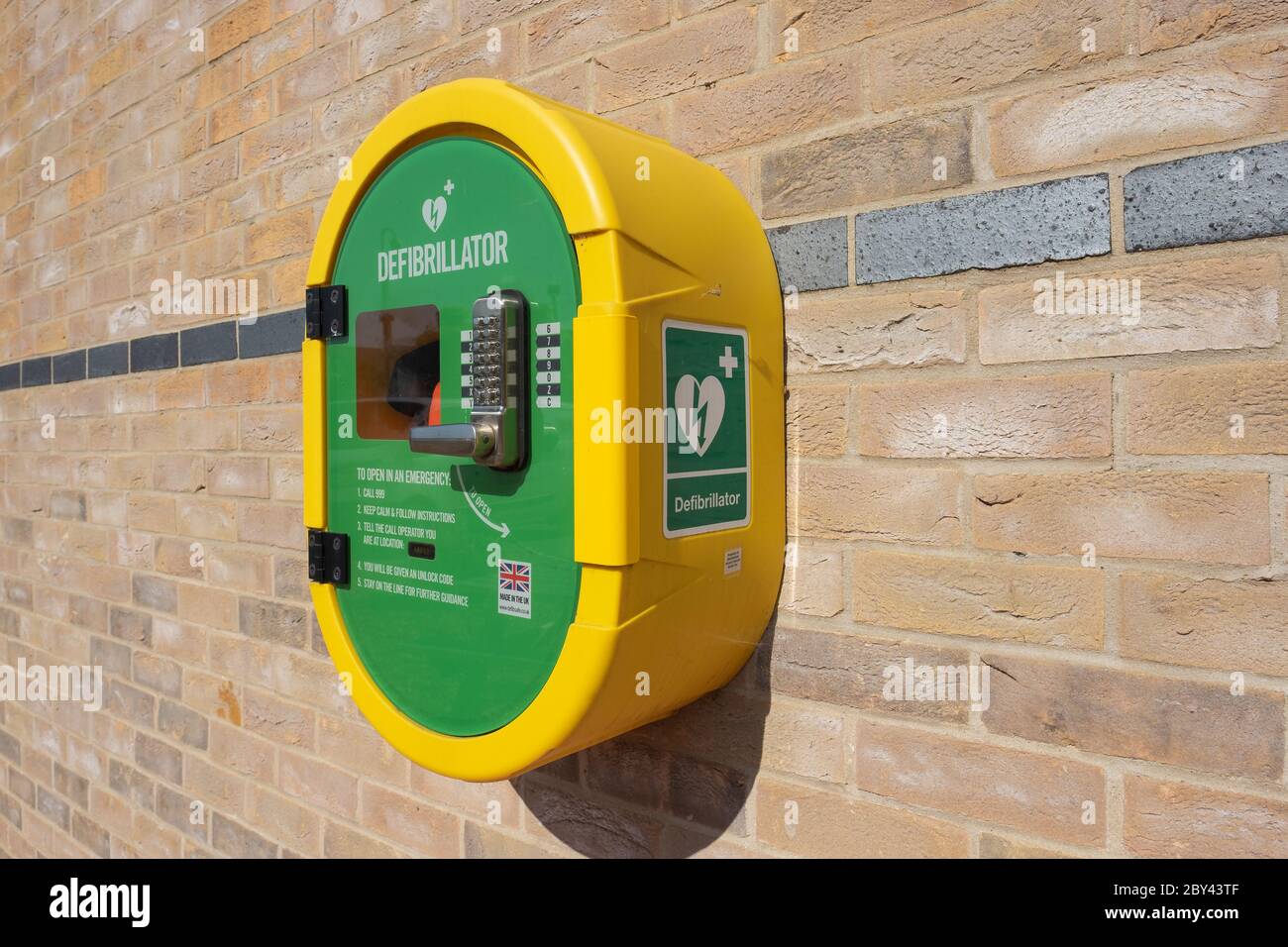 Newly installed emergency cardiac defibrillator unit seen attached to a ...