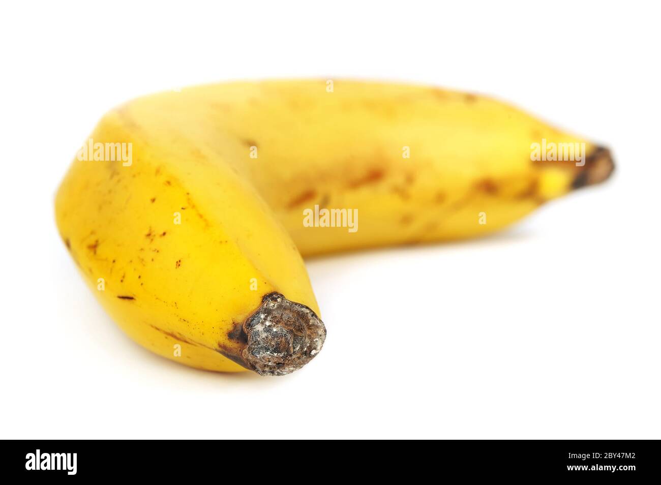 Old bad banana isolated on white background Stock Photo - Alamy