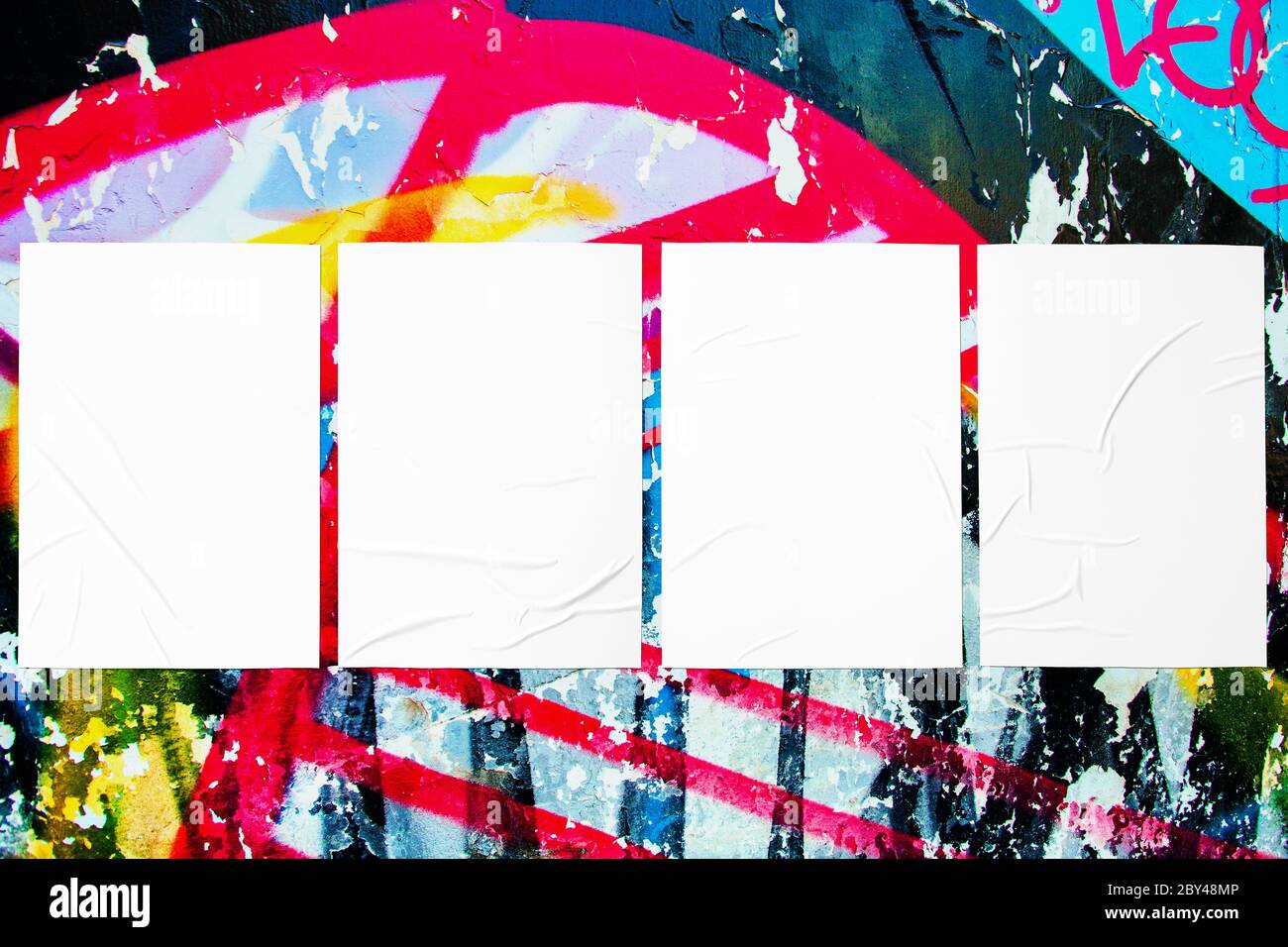 close up of colorful messy painted urban wall texture with four ...