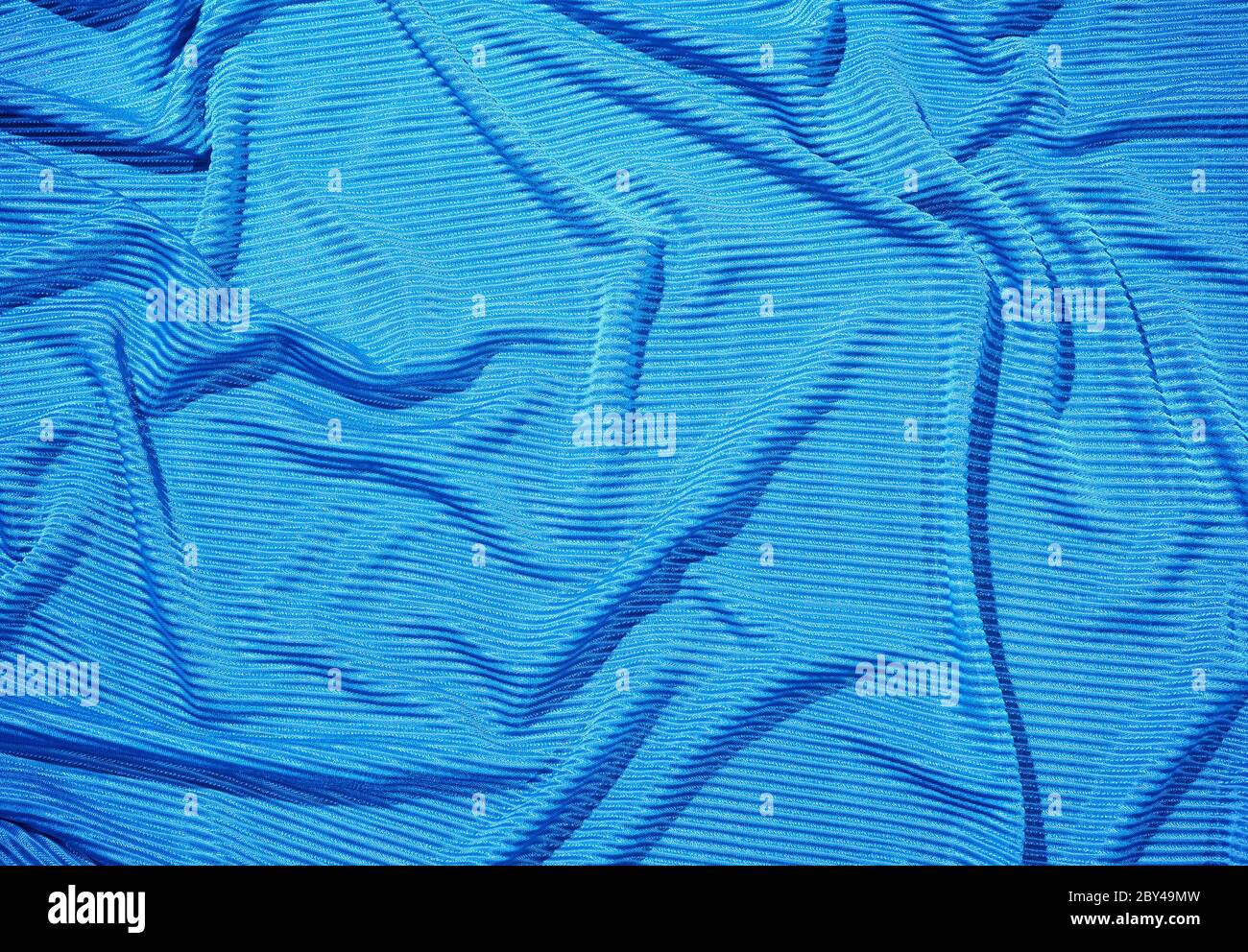 Blue rippled cloth as background Stock Photo - Alamy