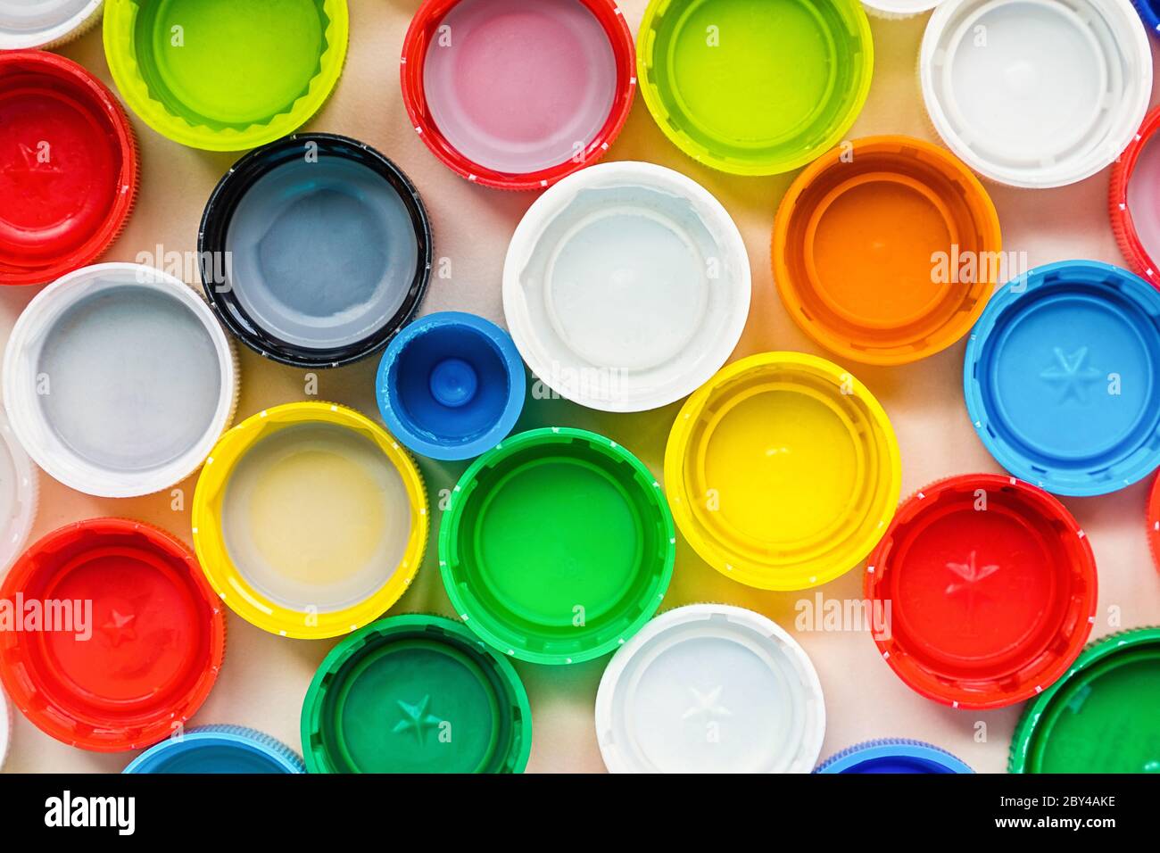 Many different colorful plastic cover background. Recycling concept ...