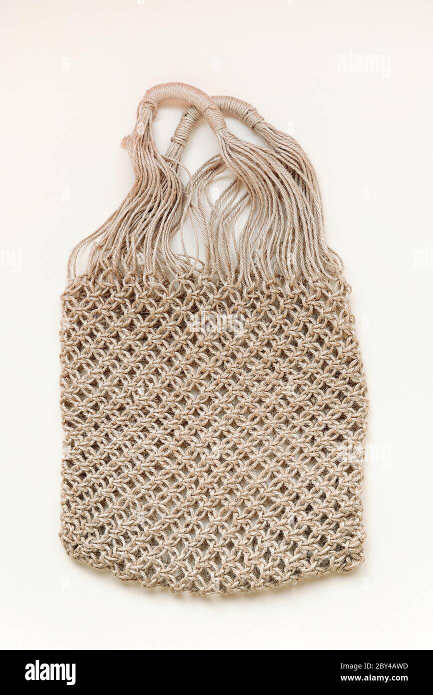Reusable net bag or mesh shopper on beige background. Zero waste ...