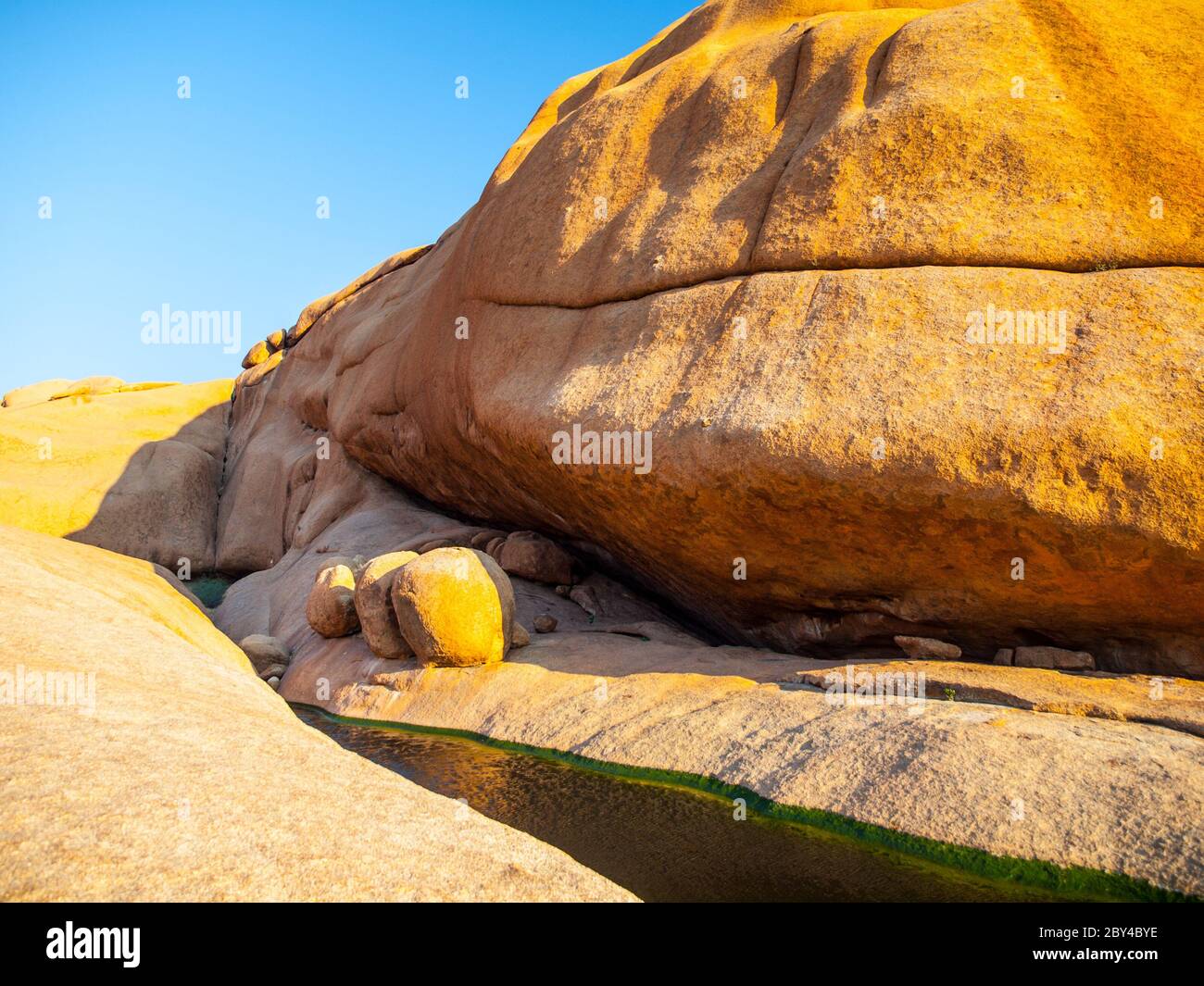 Small water basin in Spitzkoppe rock formation, Namib Desert, Namibia ...