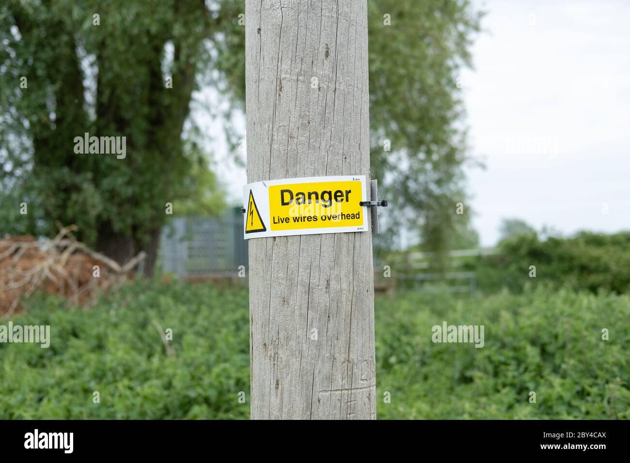 Newly installed Danger sign attached to a wooden pole which has ...