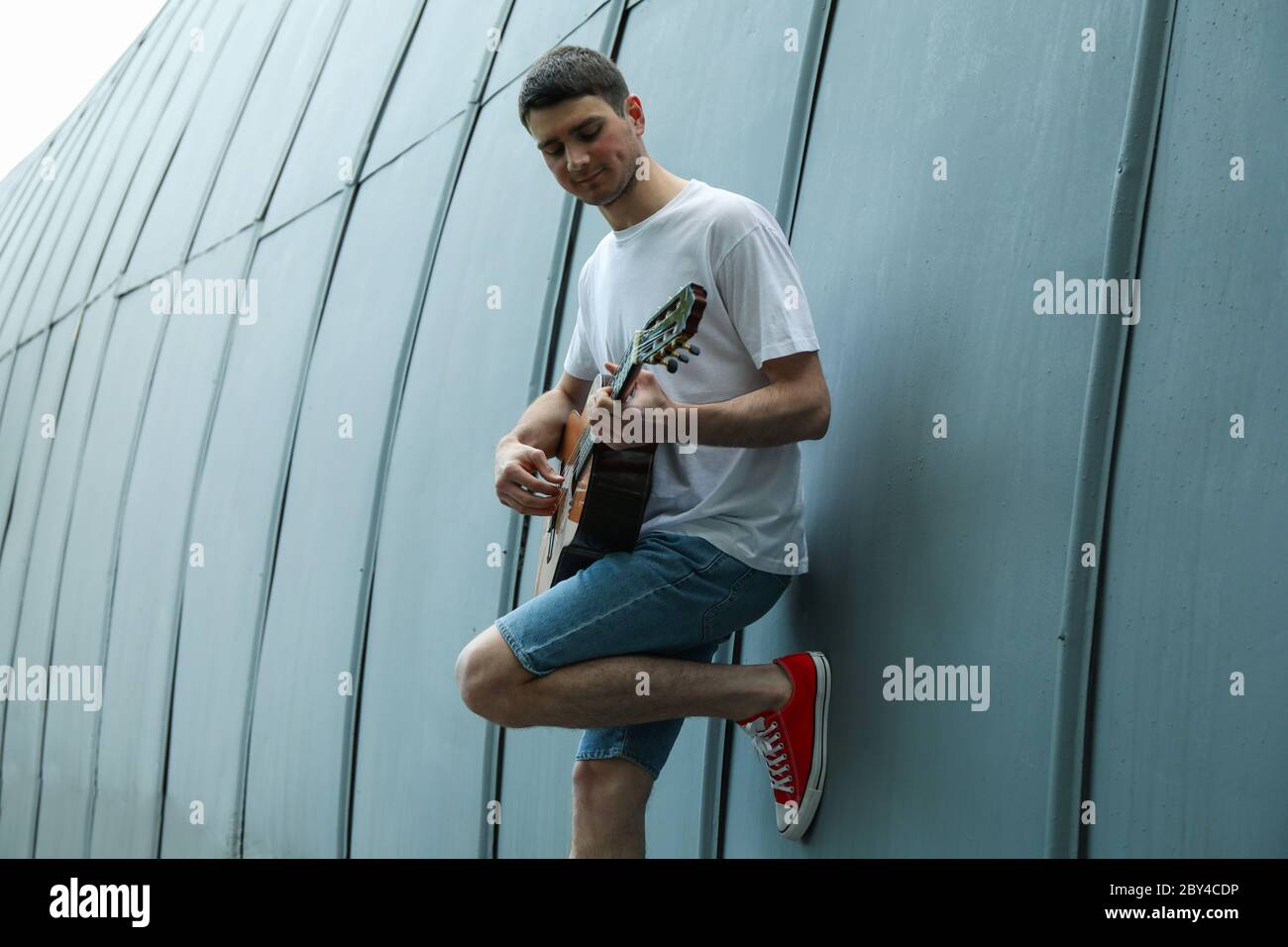 Guitar acoustic wall man musician instrument hi-res stock photography ...