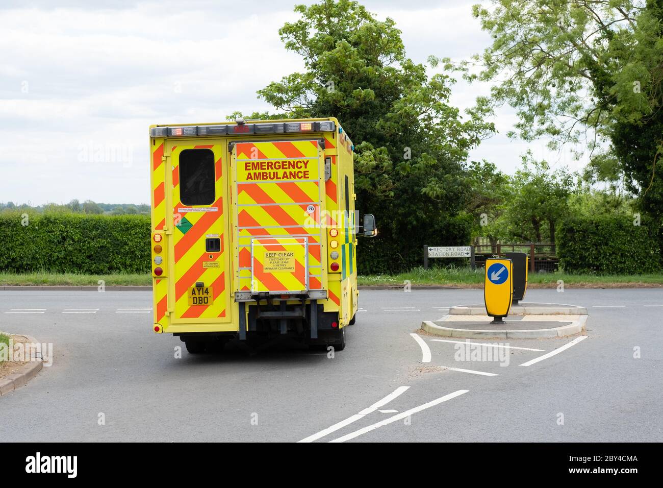 Emergency ambulance seen following a Diversion Sign at a urban road ...
