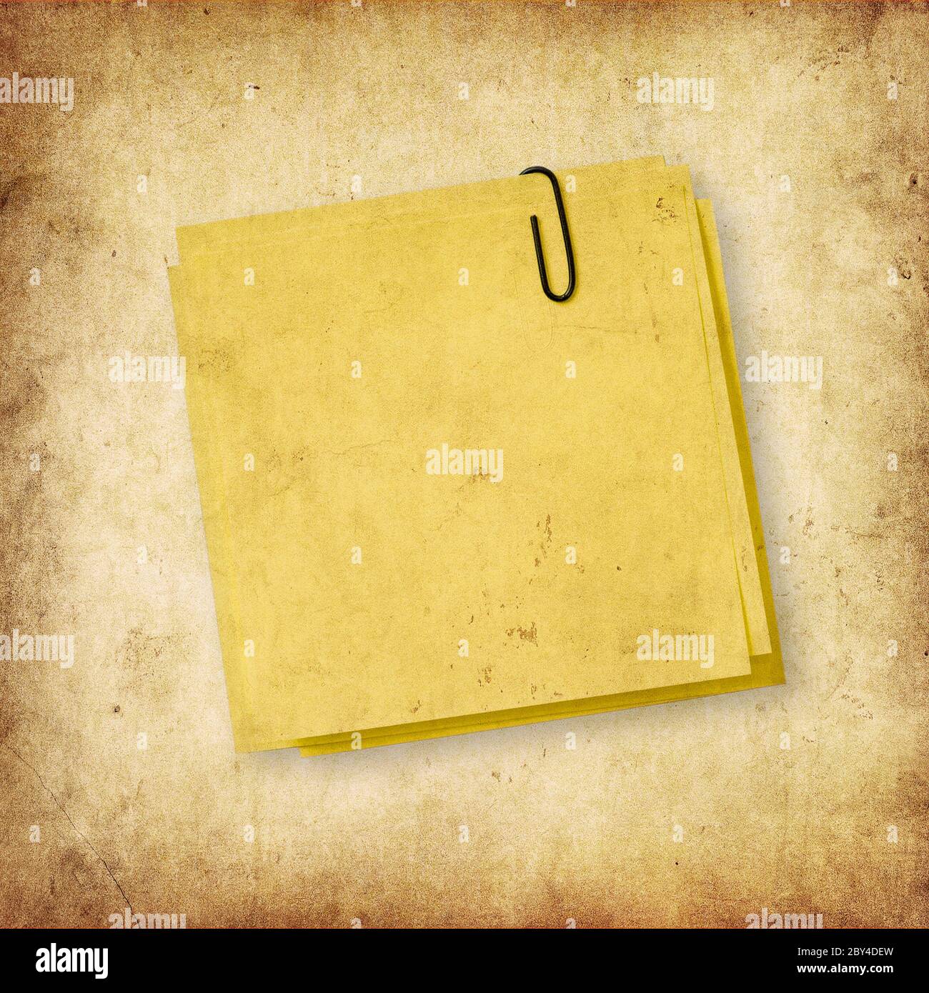 yellow note over grunge background Stock Photo - Alamy