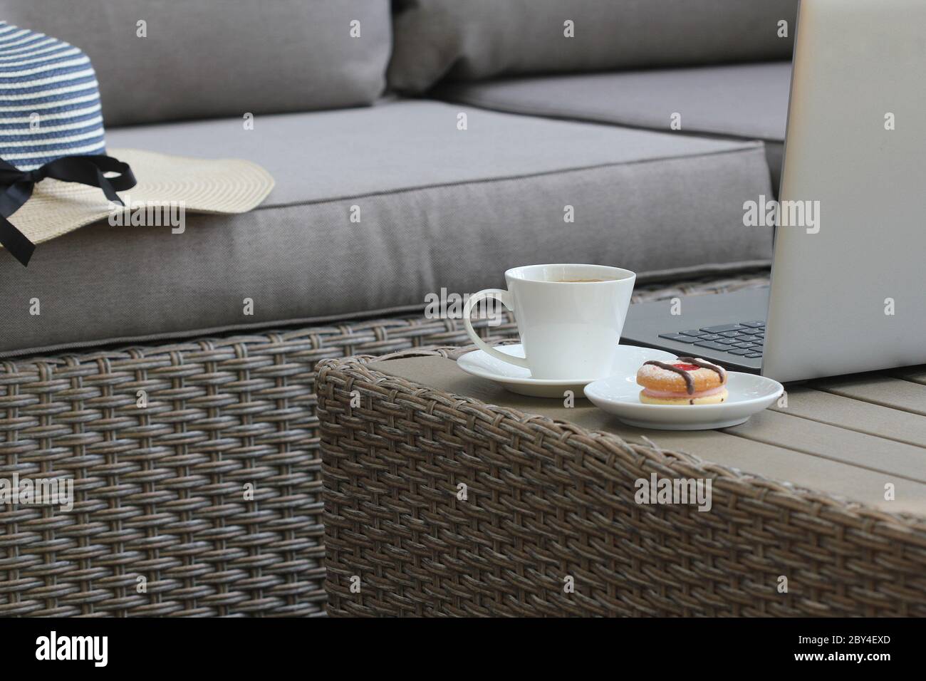 Outdoor furniture lounge group with chairs, sofa and table in a patio ...