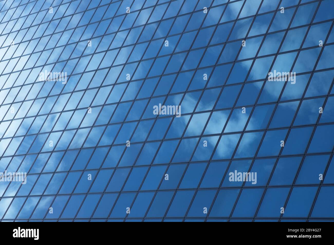 sky reflecting in windows of office building Stock Photo - Alamy
