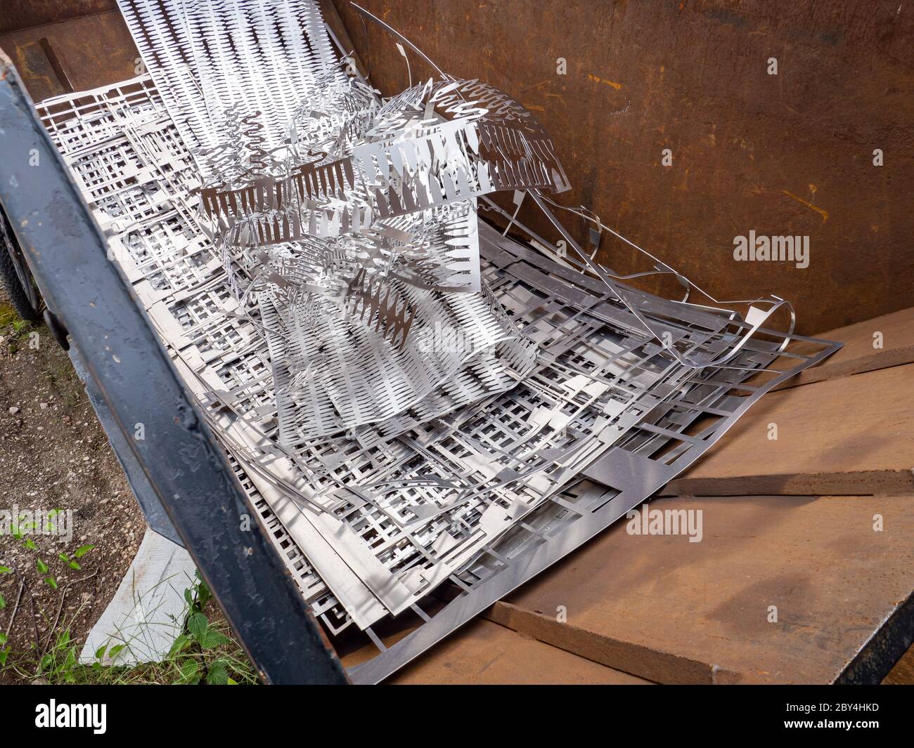 Containers with scrap steel background Stock Photo - Alamy