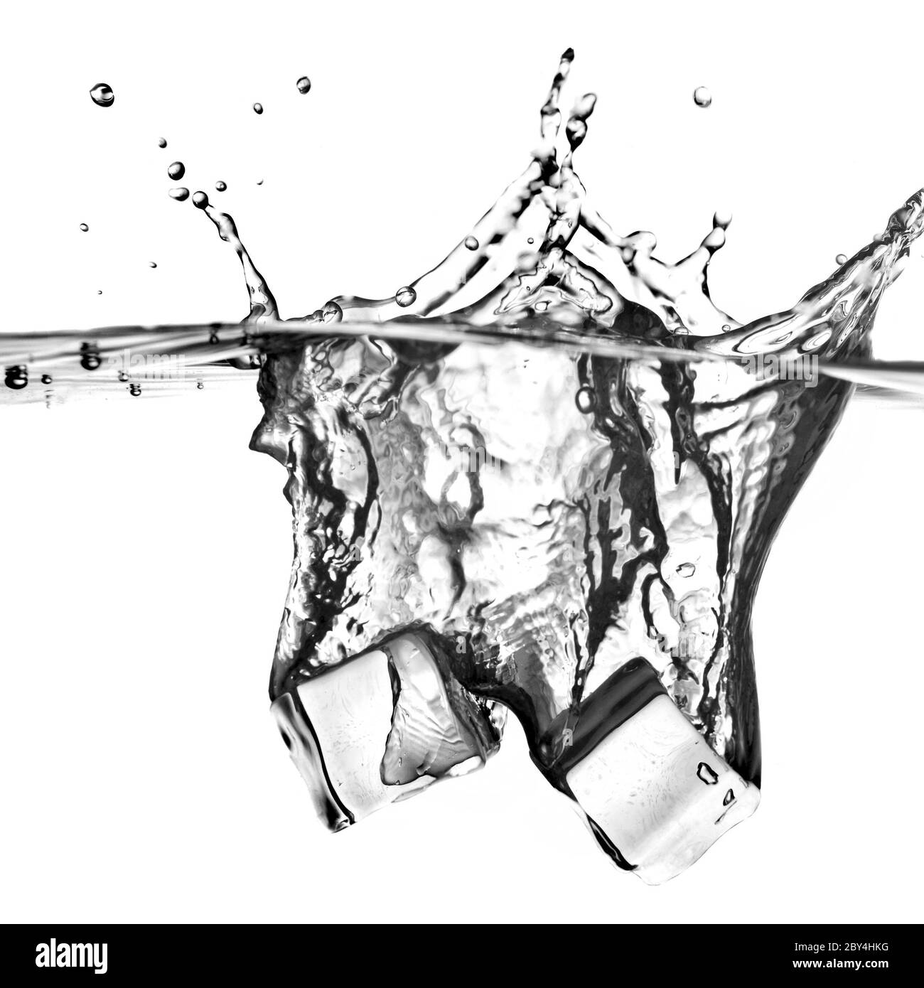 ice cubes dropped into water with splash isolated on white Stock Photo ...