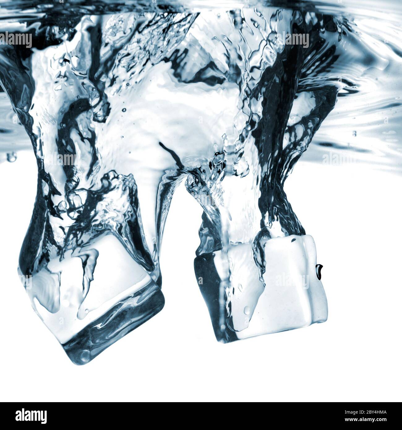 ice cubes dropped into water with splash isolated on white Stock Photo - Alamy