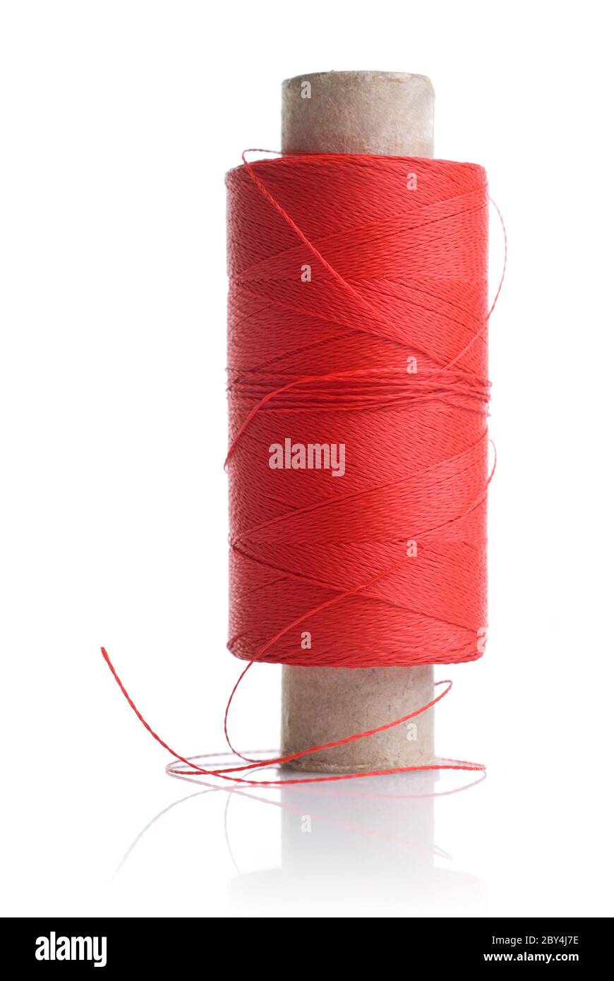 red thread and coil isolated on white Stock Photo - Alamy