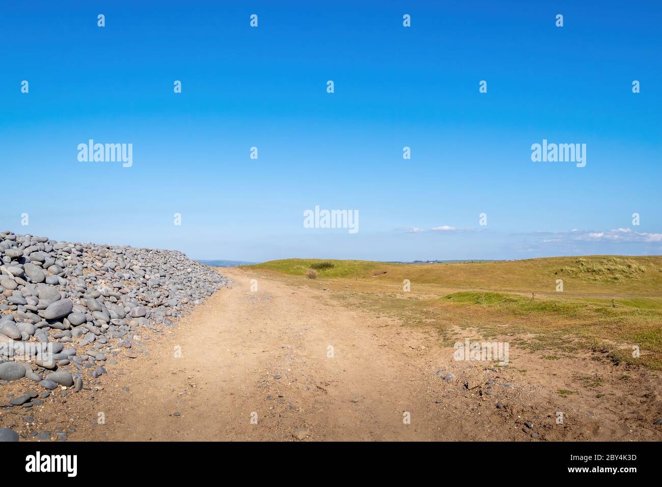 Path across Northam Burrows reserve and SSSI, with grass, sand and ...