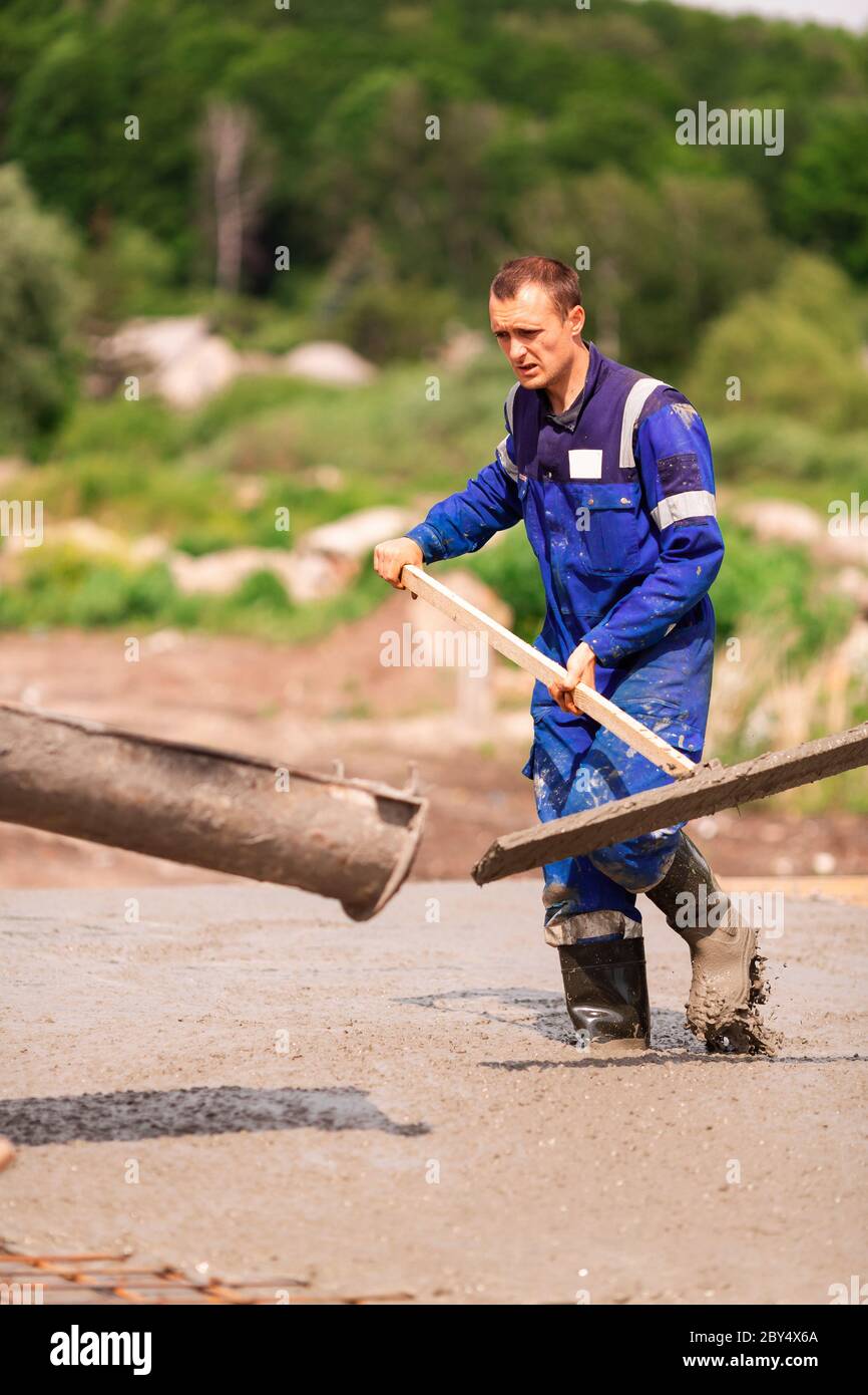 Leveling of the cement or concrete of the foundation formwork from ...