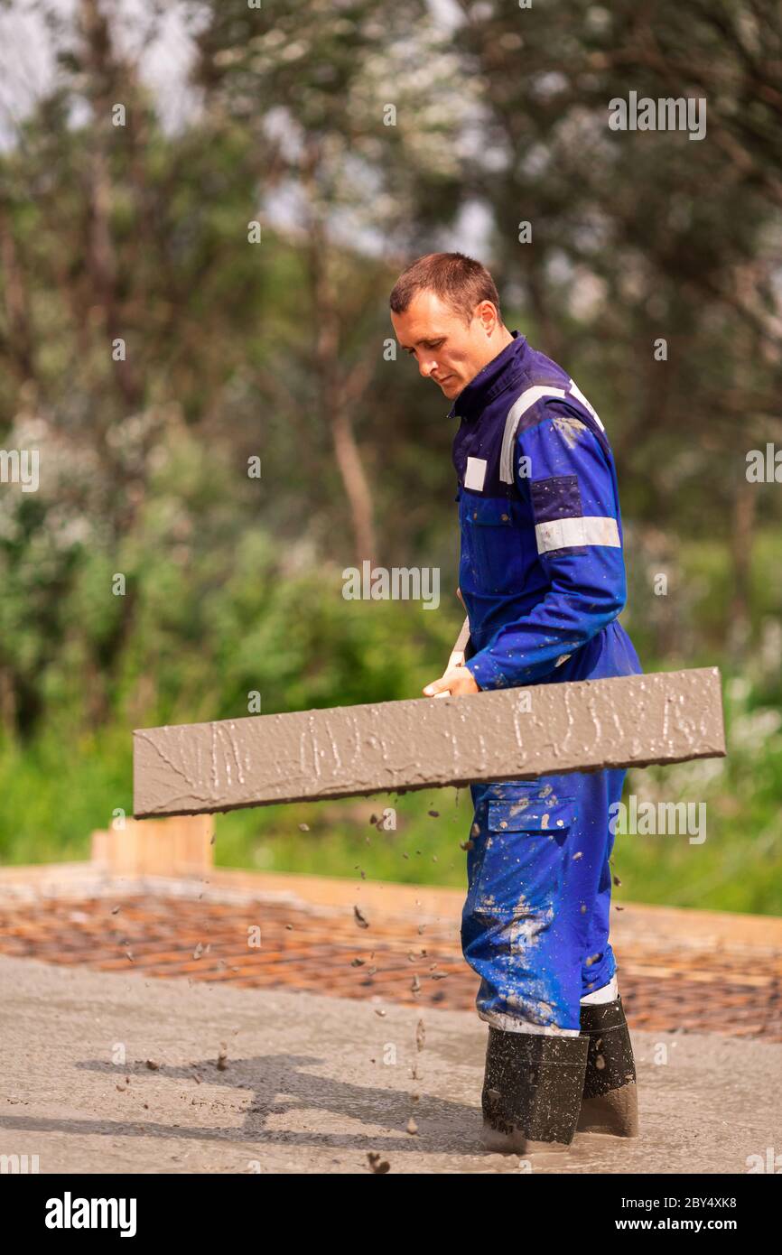 Leveling of the cement or concrete of the foundation formwork from ...