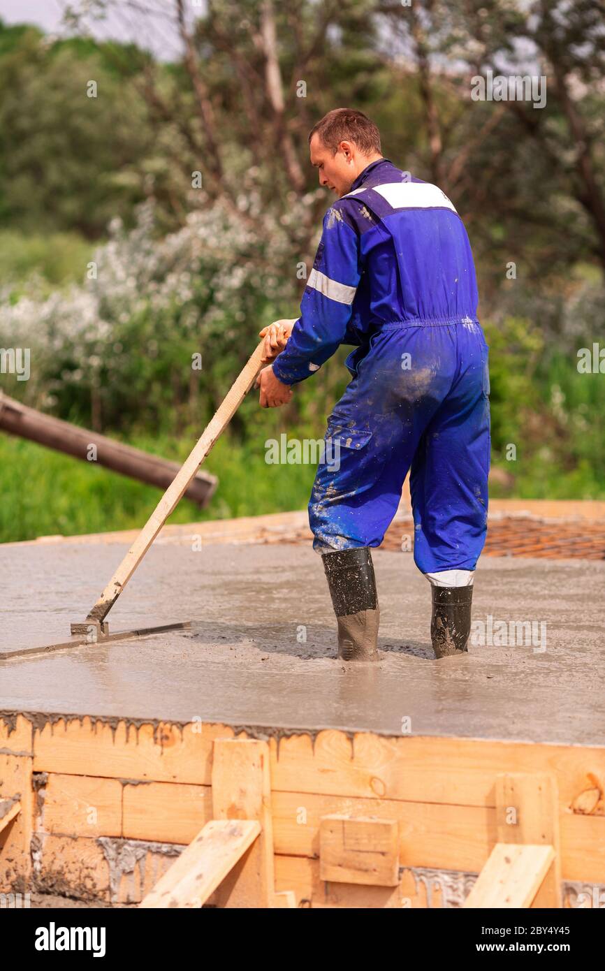 Leveling of the cement or concrete of the foundation formwork from ...