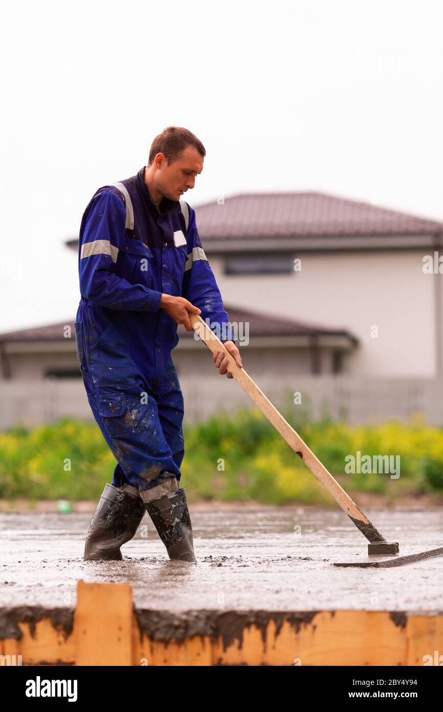 Leveling of the cement or concrete of the foundation formwork from ...