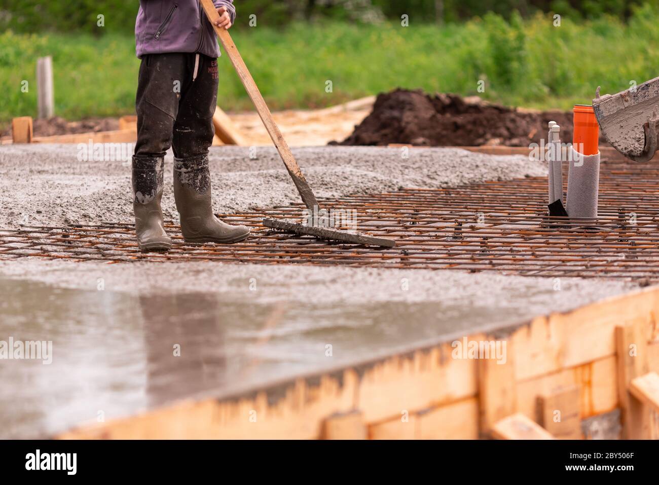 Leveling of the cement or concrete of the foundation formwork from ...